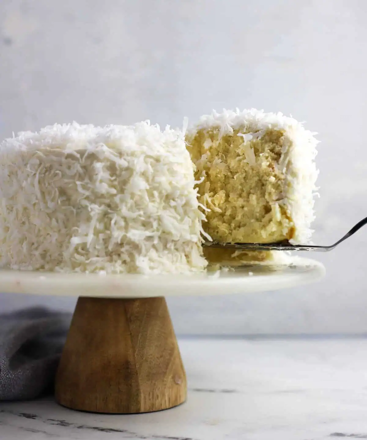 The Best Coconut Cake With Icing Ever! (Easy + Moist)