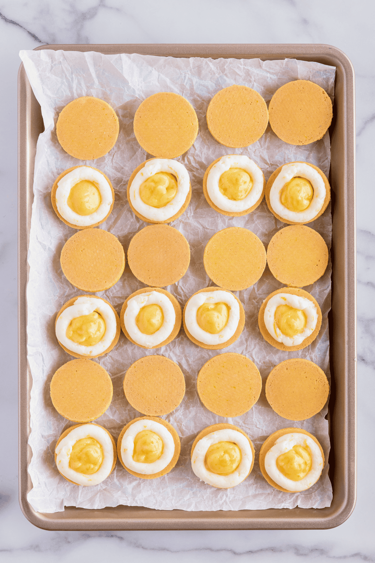 Lemon Macarons (Filled With Lemon Frosting and Lemon Curd!)